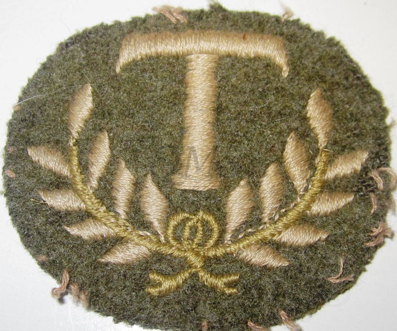 Trade badge T (Technician)